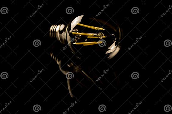Light Bulb on a Black Background Stock Photo - Image of bulb, science ...
