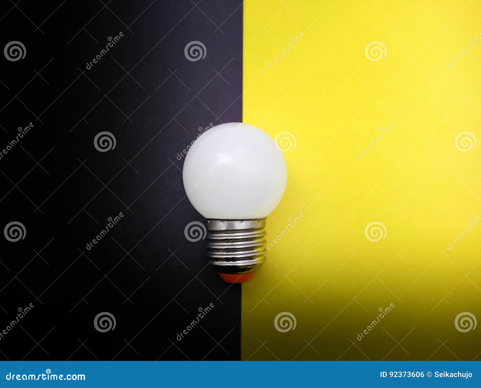 Light Bulb on Black and Yellow Paper Stock Photo - Image of innovative ...