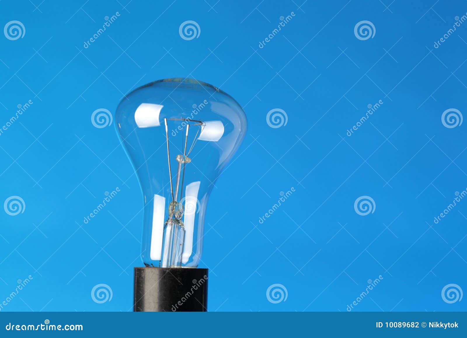 Light bulb on blue stock photo. Image of equipment, closeup - 10089682