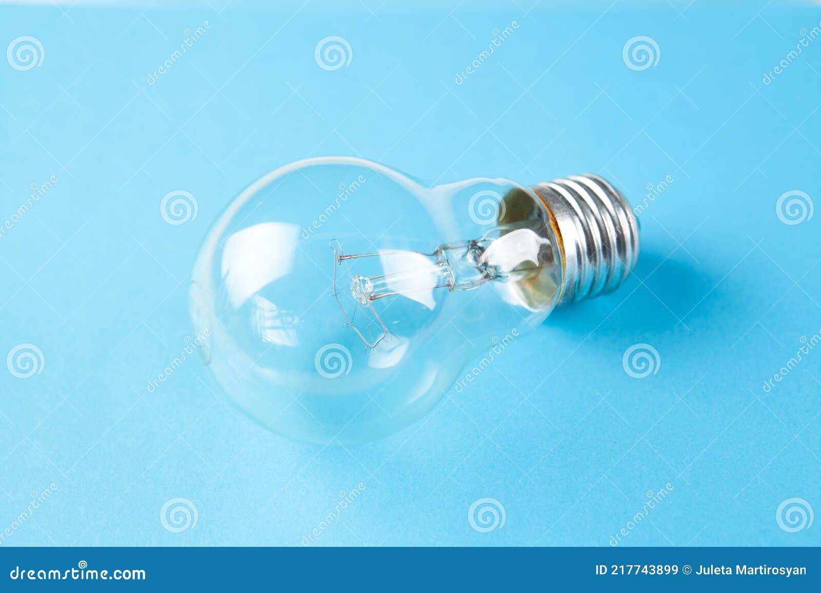 Light Bulb on Blue Background Stock Image - Image of electrical ...