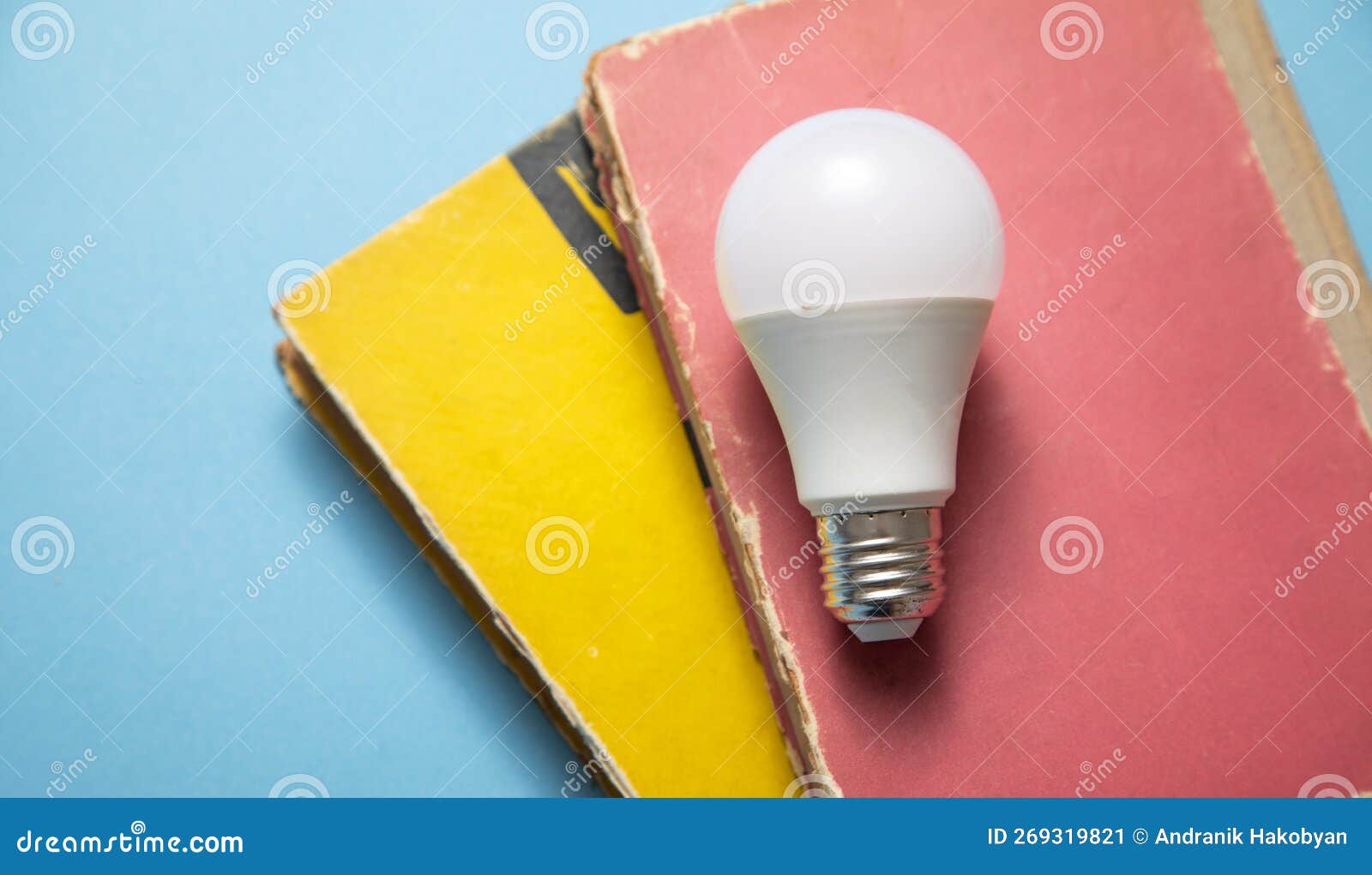 Light Bulb and Book on the Blue Background. Knowledge and Wisdom Stock ...
