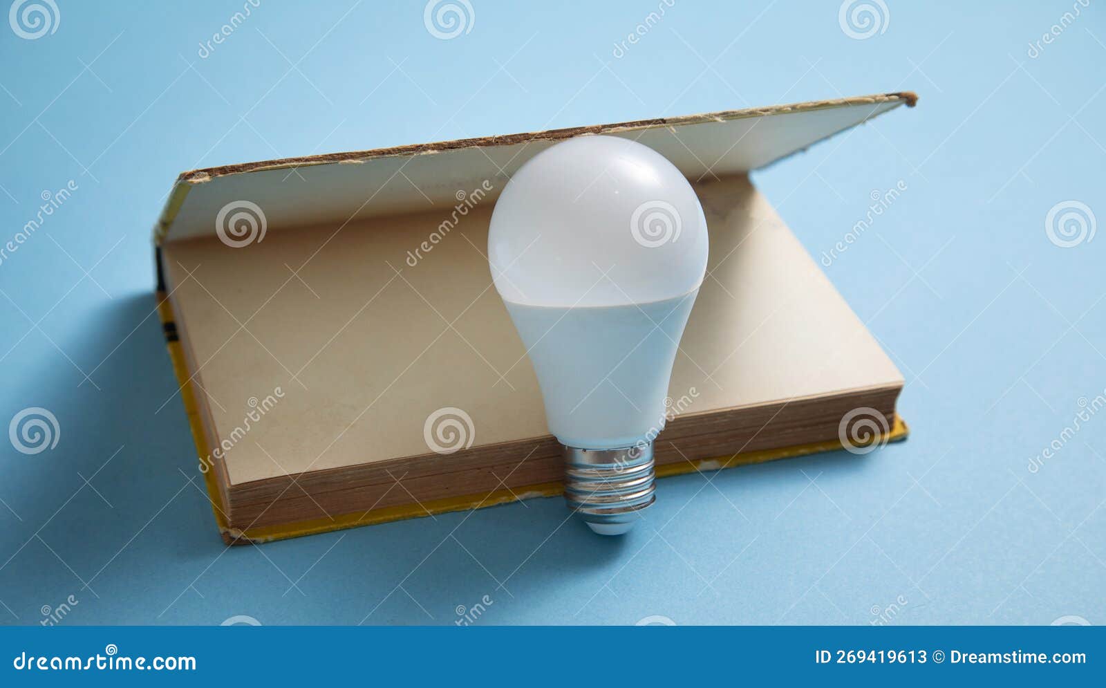 Light Bulb and Book on the Blue Background. Knowledge and Wisdom Stock ...
