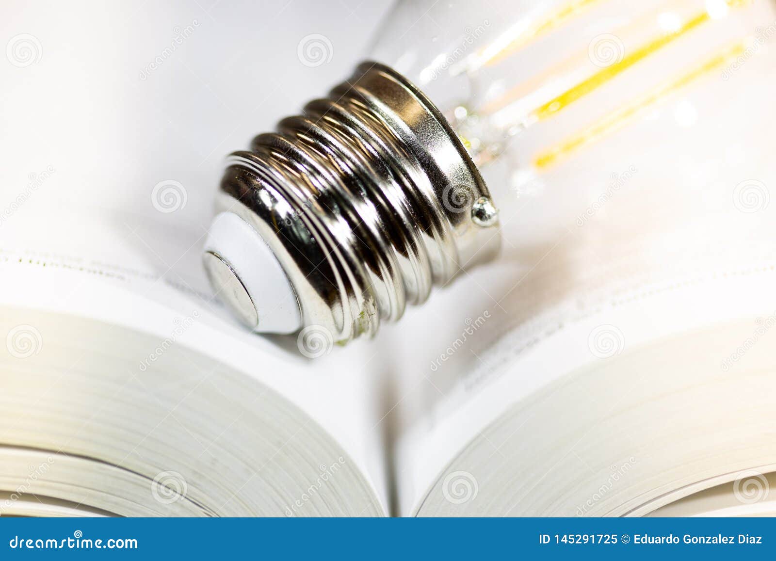Light bulb on a book stock image. Image of creativity - 145291725