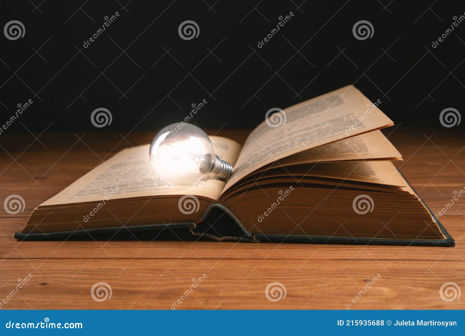 Light Bulb and Book on the Table Stock Photo - Image of learn, power ...