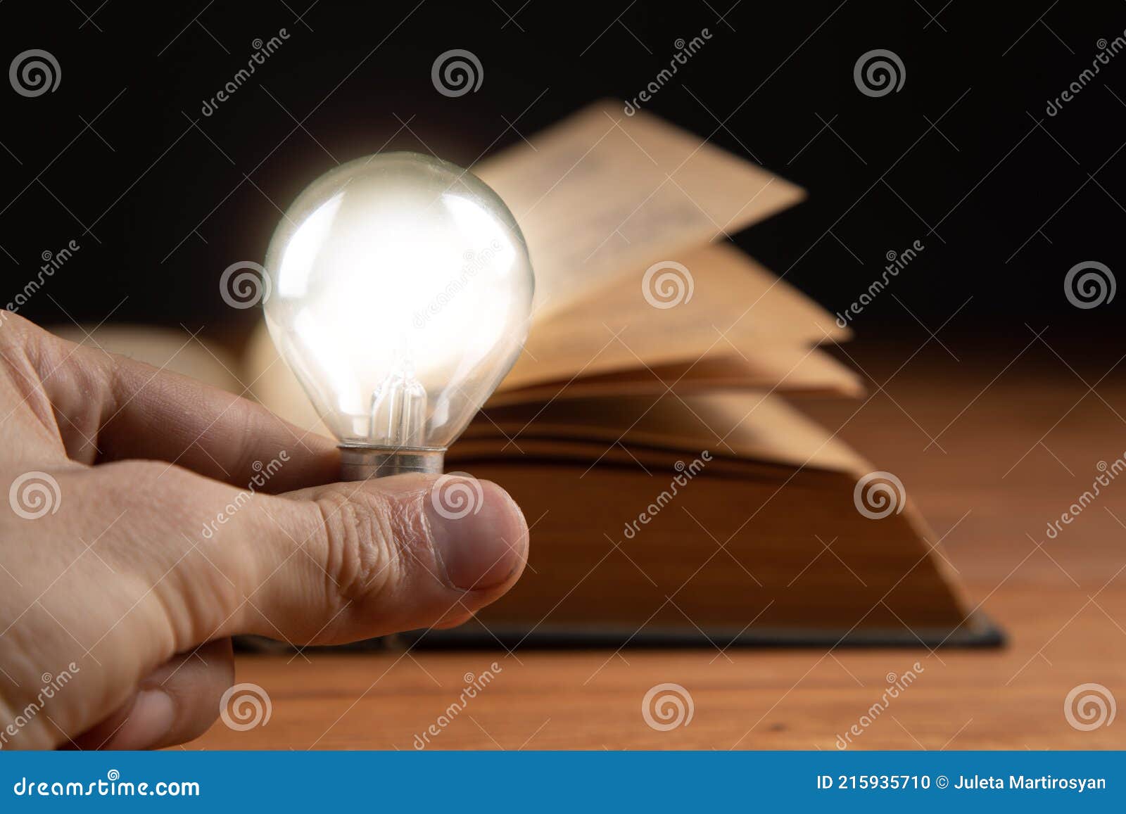 Light Bulb and Book on the Table Stock Photo - Image of business, glow ...