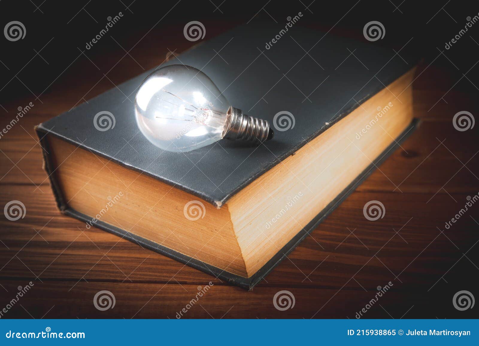 Light Bulb and Book on the Table Stock Image - Image of story ...