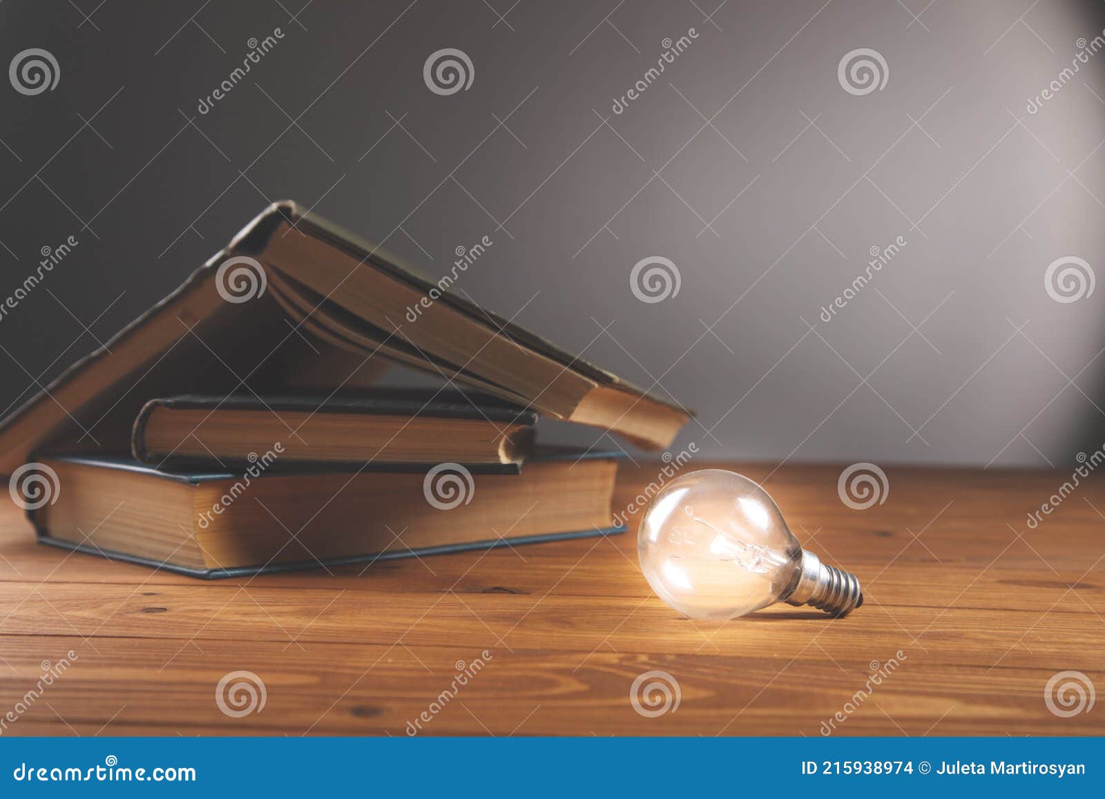 Light Bulb and Book on the Table Stock Photo - Image of concept, book ...