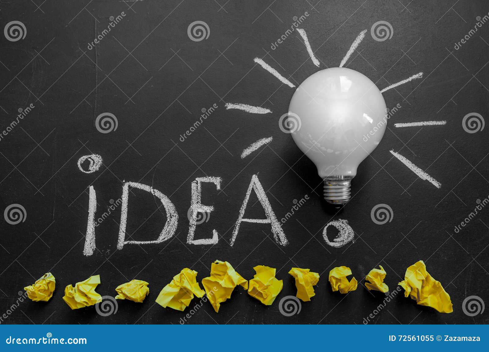 Light Bulb on Chalkboard with Title Idea!and Crumpled Yellow Papers ...