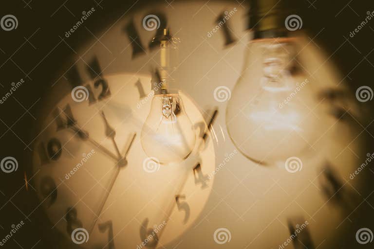 Light bulb and clock stock image. Image of education - 85996175