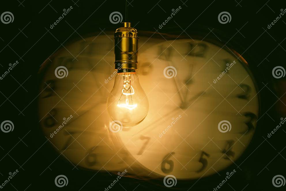 Light bulb and clock stock photo. Image of light, watch - 85996180