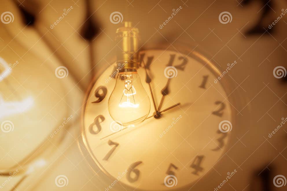 Light bulb and clock stock photo. Image of yellow, background - 86109200