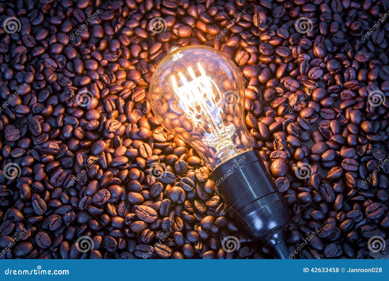 Light bulb on coffee beans stock photo. Image of ground - 42633458
