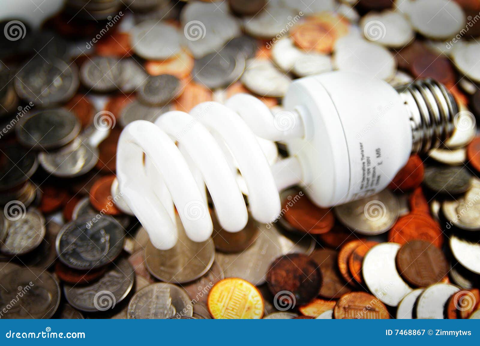 Light bulb and coins stock image. Image of fluorescent - 7468867