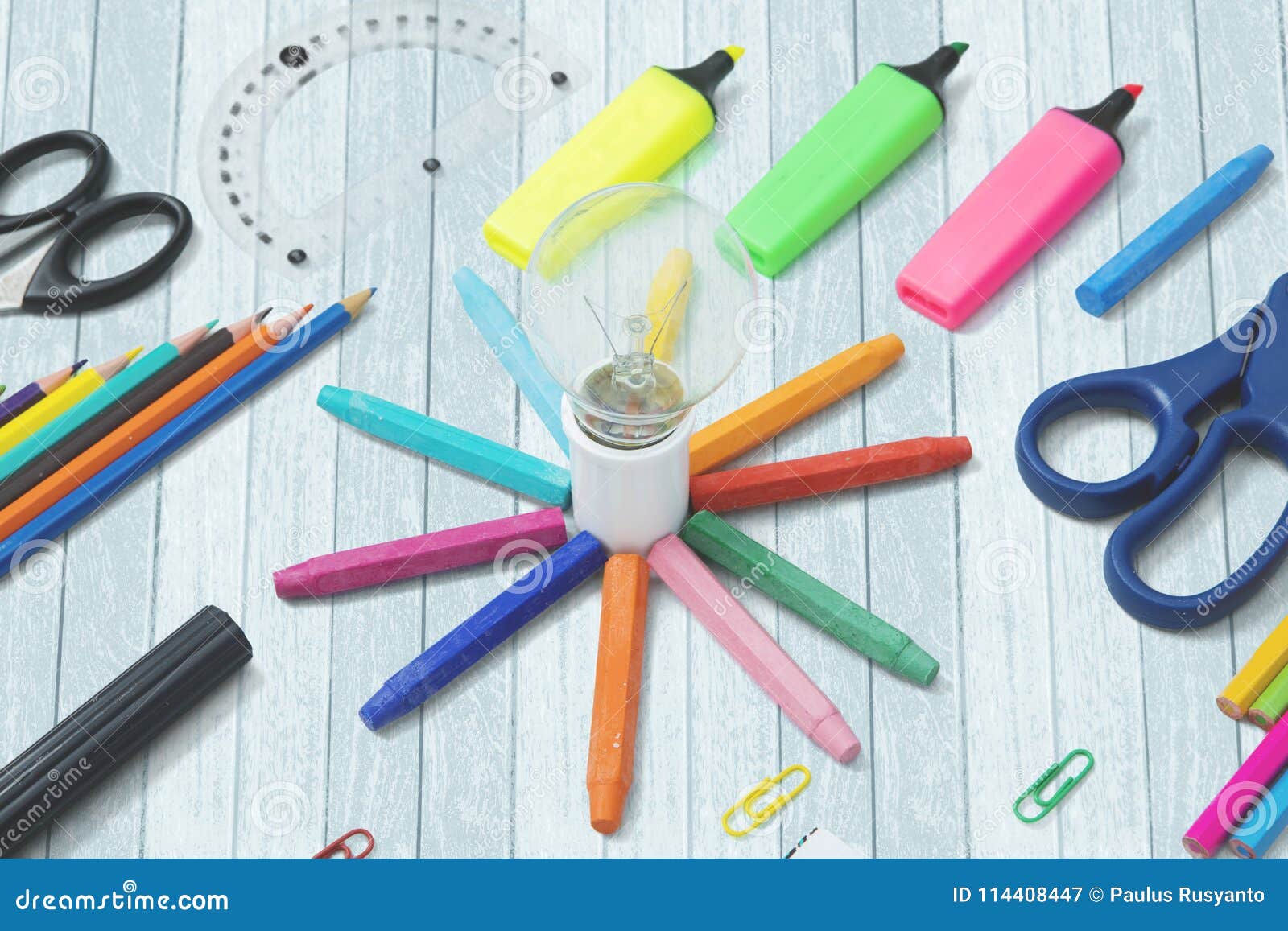 Light Bulb with Colored Crayons on the Table Stock Image - Image of ...