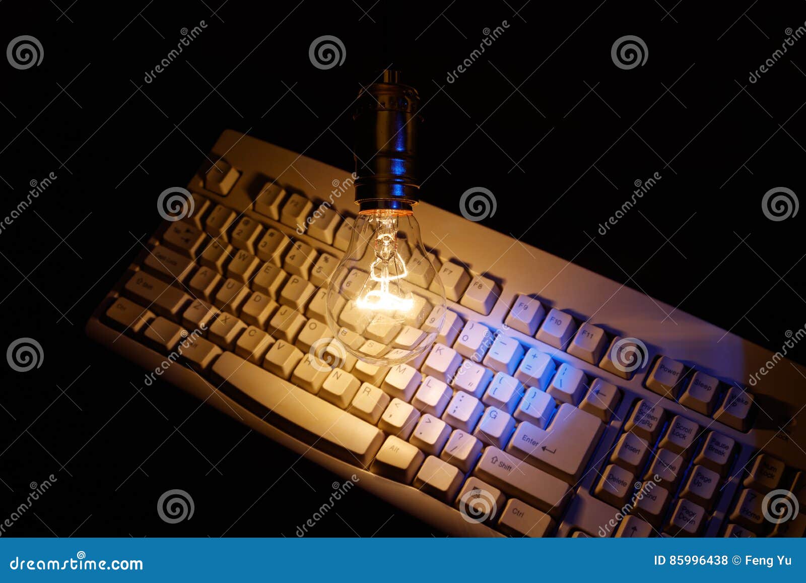 Light Bulb and Computer Keyboard Stock Photo - Image of bulb, lightbulb ...