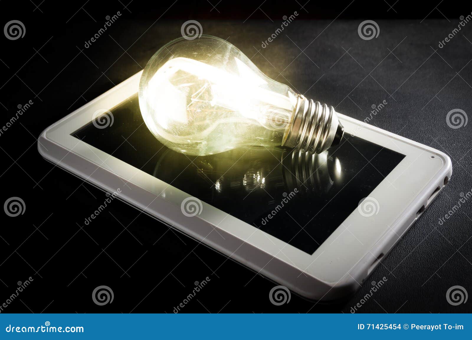 Light Bulb on Computer Tablet. Stock Photo - Image of information ...