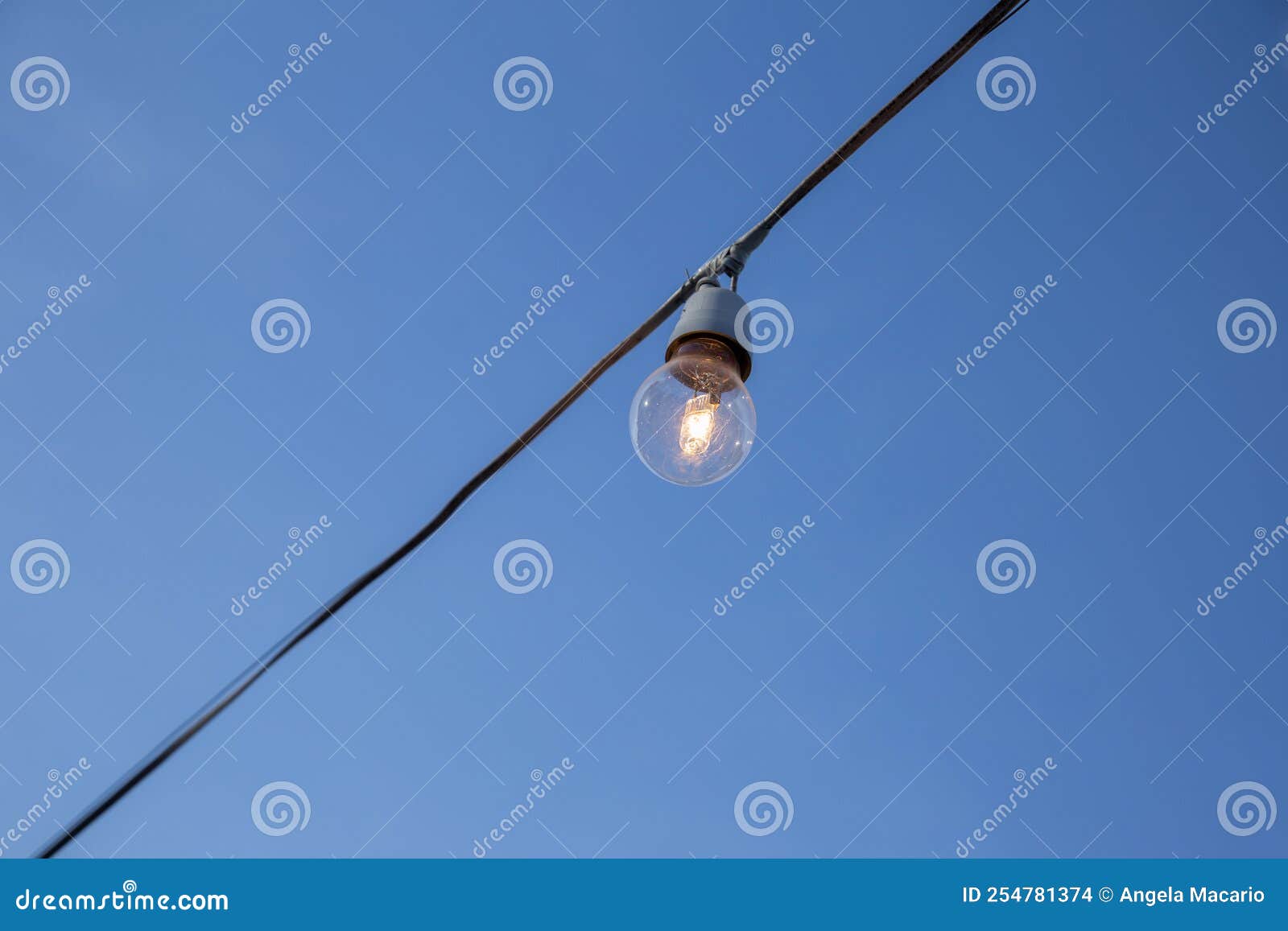 A Light Bulb Connected To an Electrical Wire. Stock Photo - Image of ...