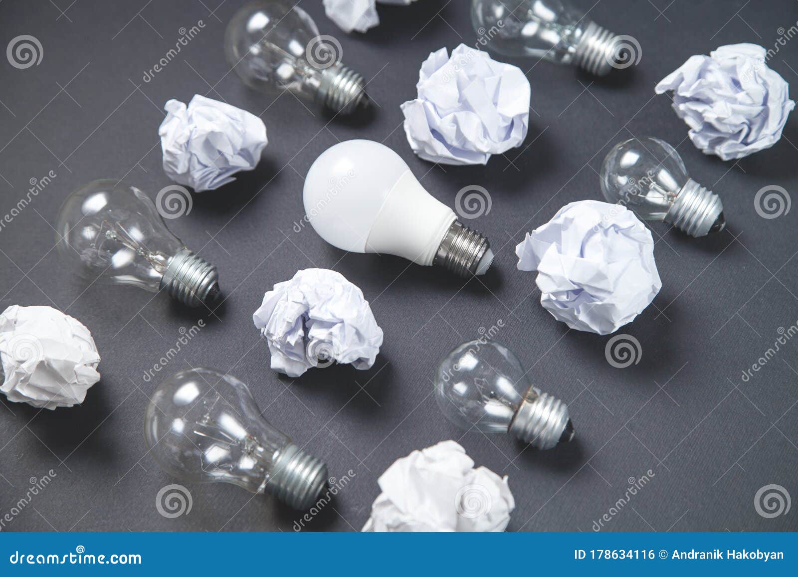 Light Bulb and Crumpled Papers in the Black Background. Idea Stock ...