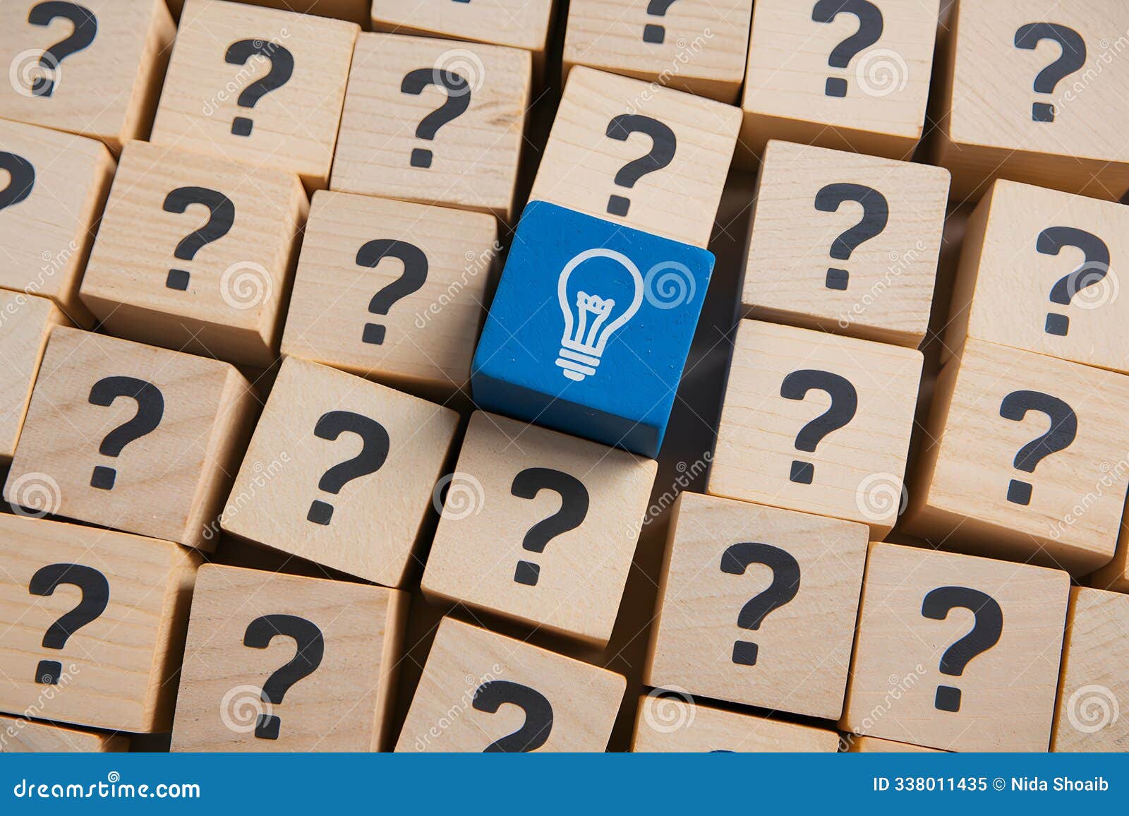 Light Bulb Cube Stands Out among Question Mark Cubes, Contrasting Blue ...