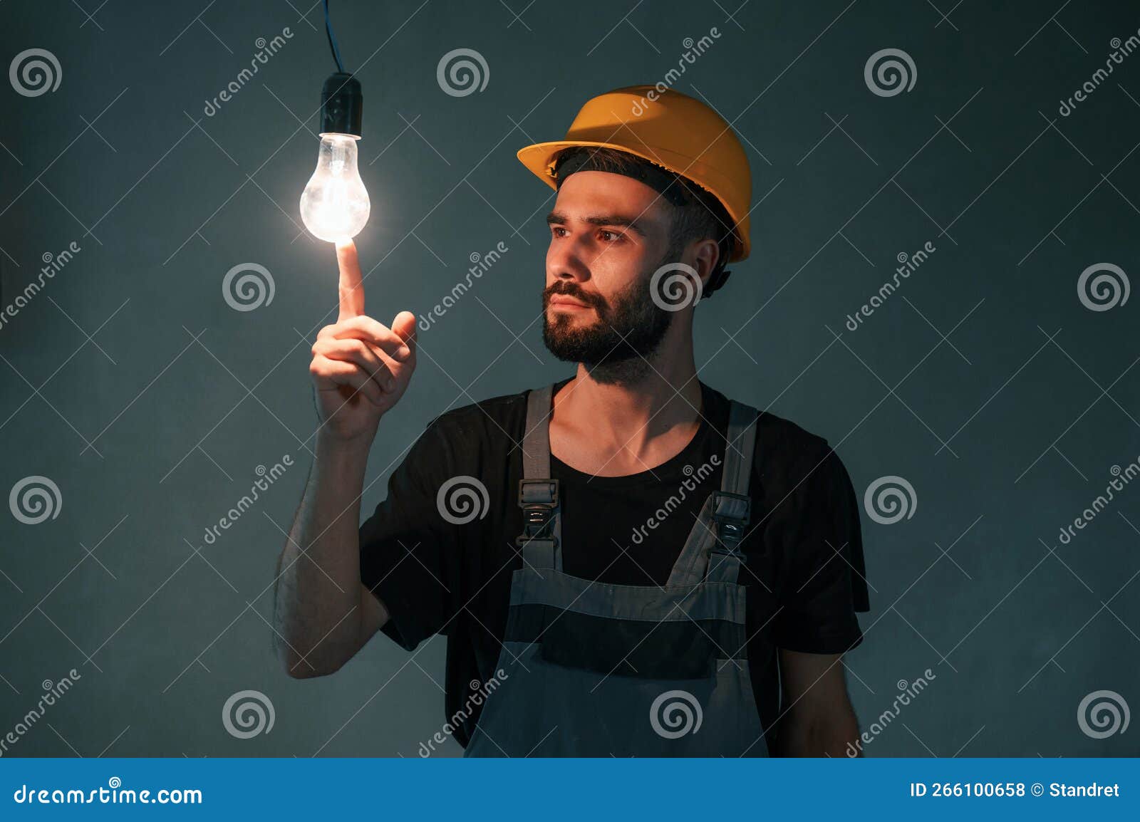 Light Bulb in the Dark Room. the Man is Making Repairs in the Apartment ...