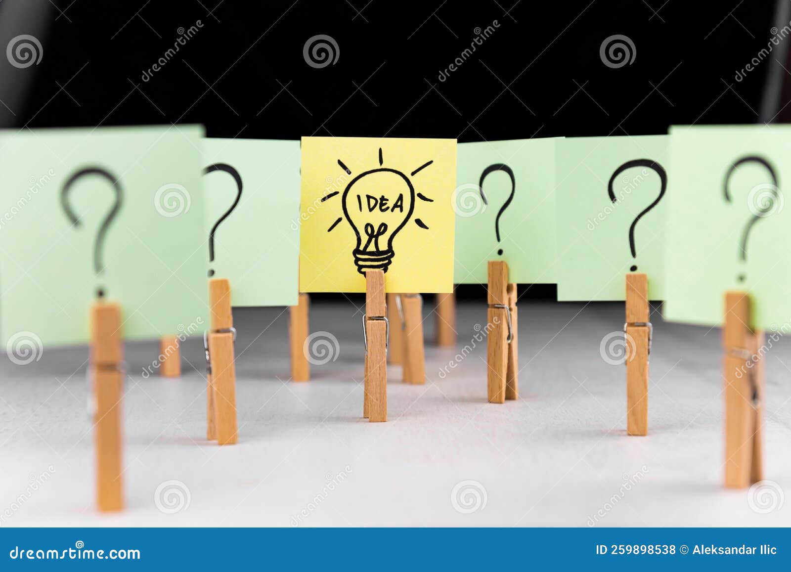 Light Bulb Doodle Drawn on Sticky Note among Many Question Marks. Hand ...