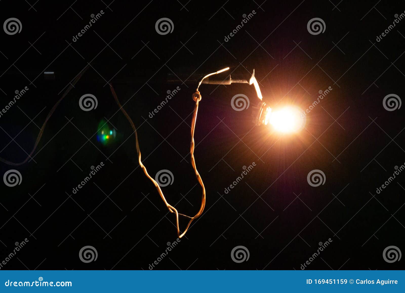 Light Bulb at the End of an Old Cable Stock Image - Image of clouds ...