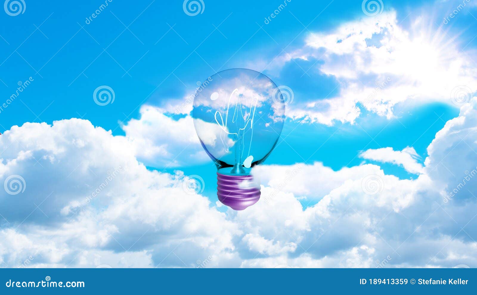 Light Bulb with Filaments and Purple Socket in the Cloudy Sky. Stock ...