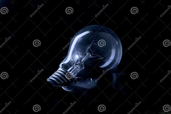 Light Bulb Floating on Water with Low Key Light Effect in Studio Stock ...