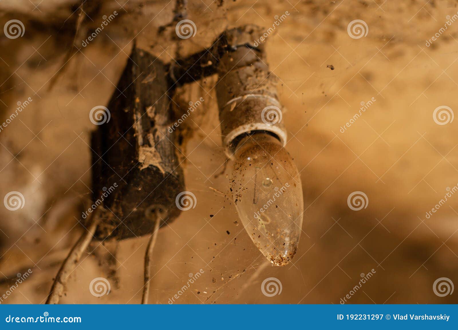 Light Bulb in the Form of a Candle in an Abandoned Room Covered in ...