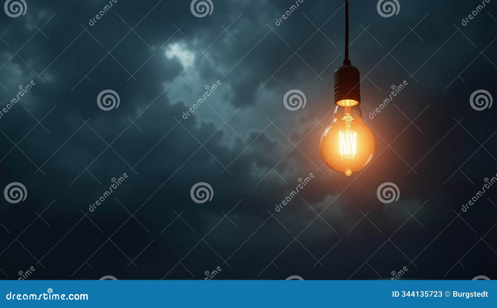 Light Bulb in Front of a Very Cloudy Sky As a Light in the Darkness or ...