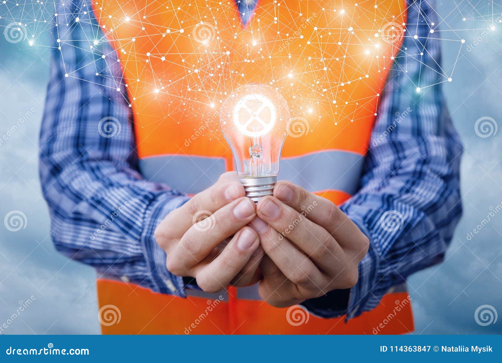 Light Bulb with Gears in the Hand of the Builder. Stock Image - Image ...