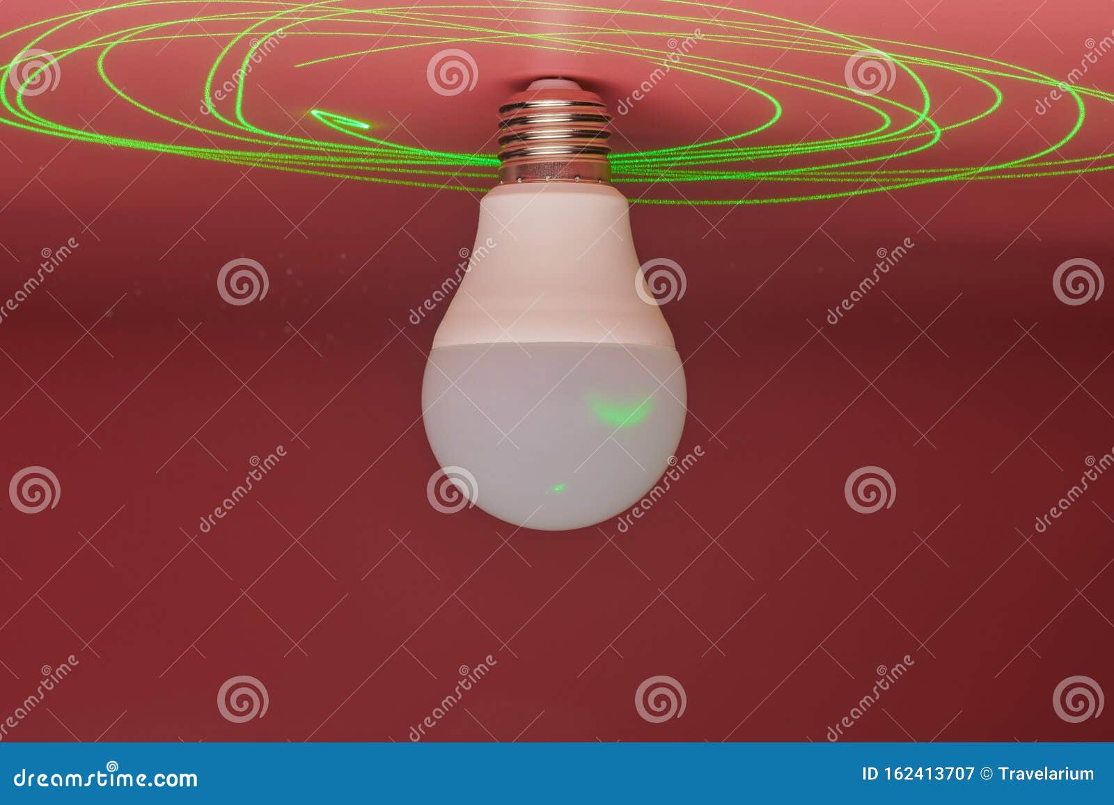 Light Bulb and Green Laser Beam Around, Energy Saving. Minimal Idea ...