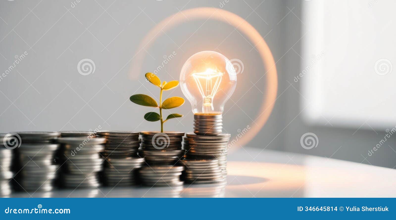 Light Bulb Growing from Stack of Coins and Small Plant Growing Next To ...