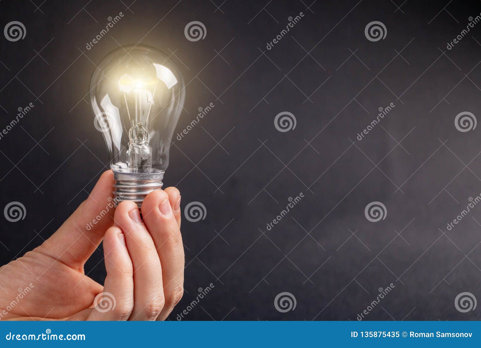 Light bulb in hand lit stock image. Image of concept - 135875435