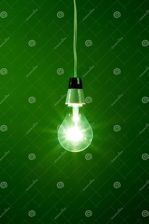 Light Bulb Hanging Against Green Background Stock Photo - Image of ...