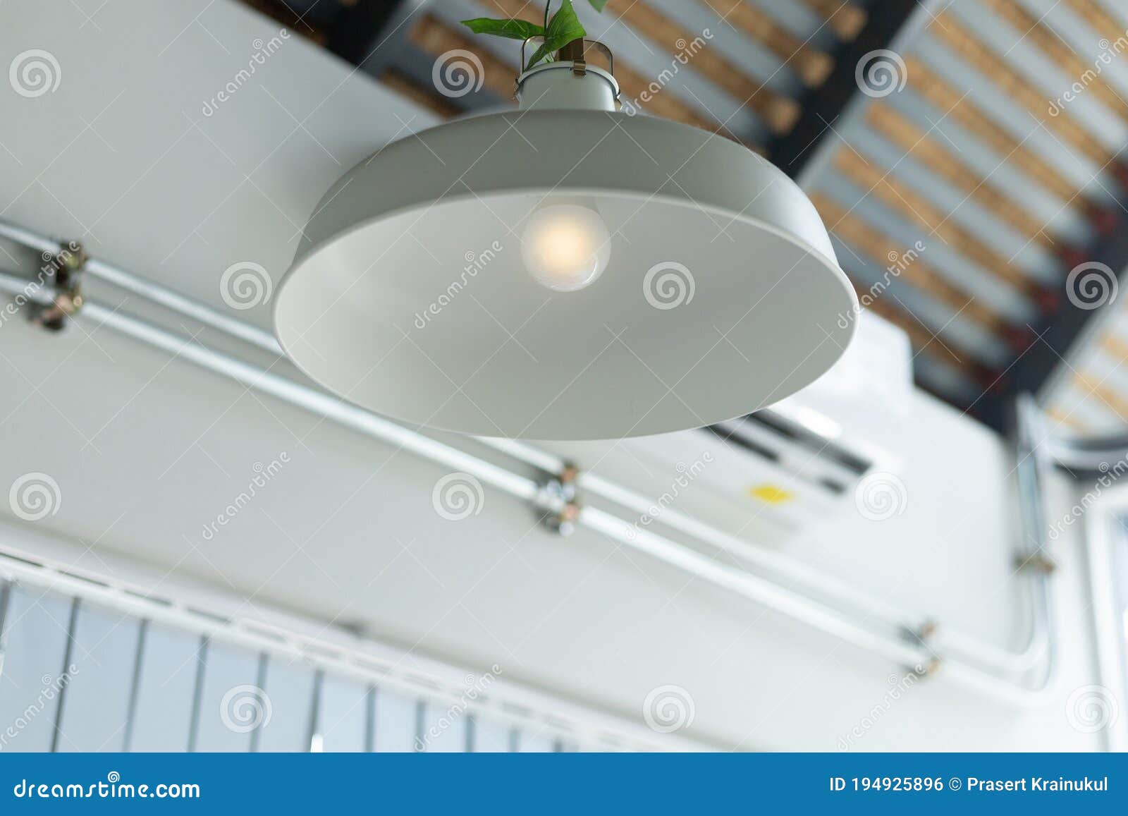 Light Bulb Hanging on Ceiling Stock Photo - Image of glow, energy ...