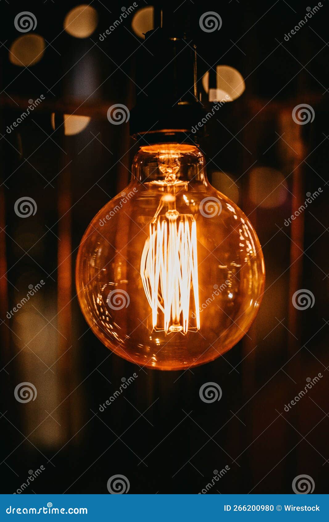 Light Bulb Hanging from a Wire in the Dark Stock Photo - Image of glass ...