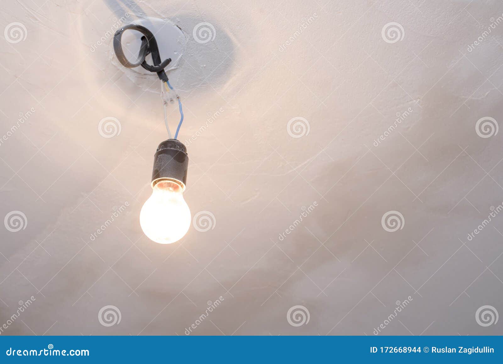 Light Bulb Hanging on Wires on White Ceiling Stock Photo - Image of ...