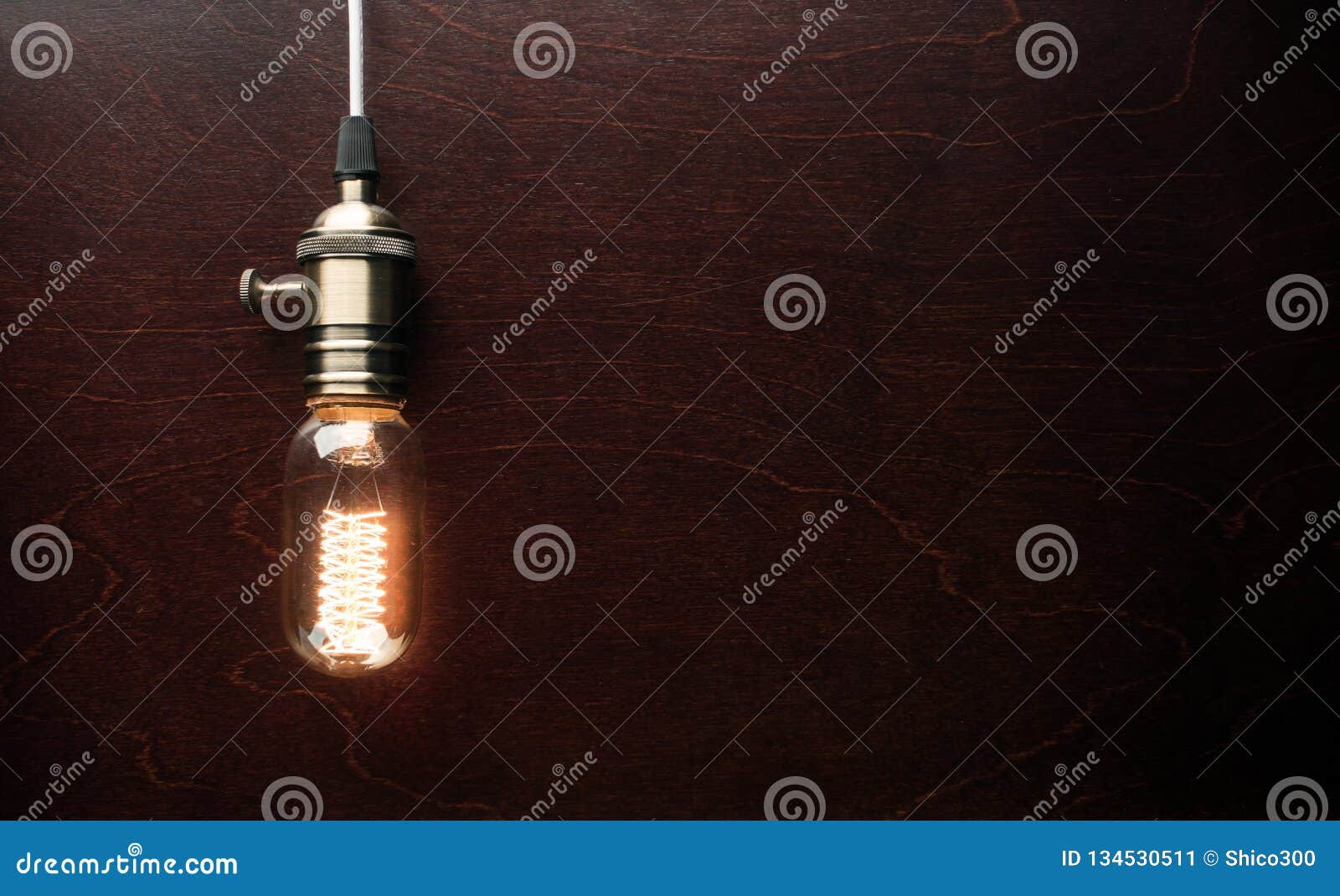 The Light Bulb Illuminates on Wooden Background Stock Image - Image of ...