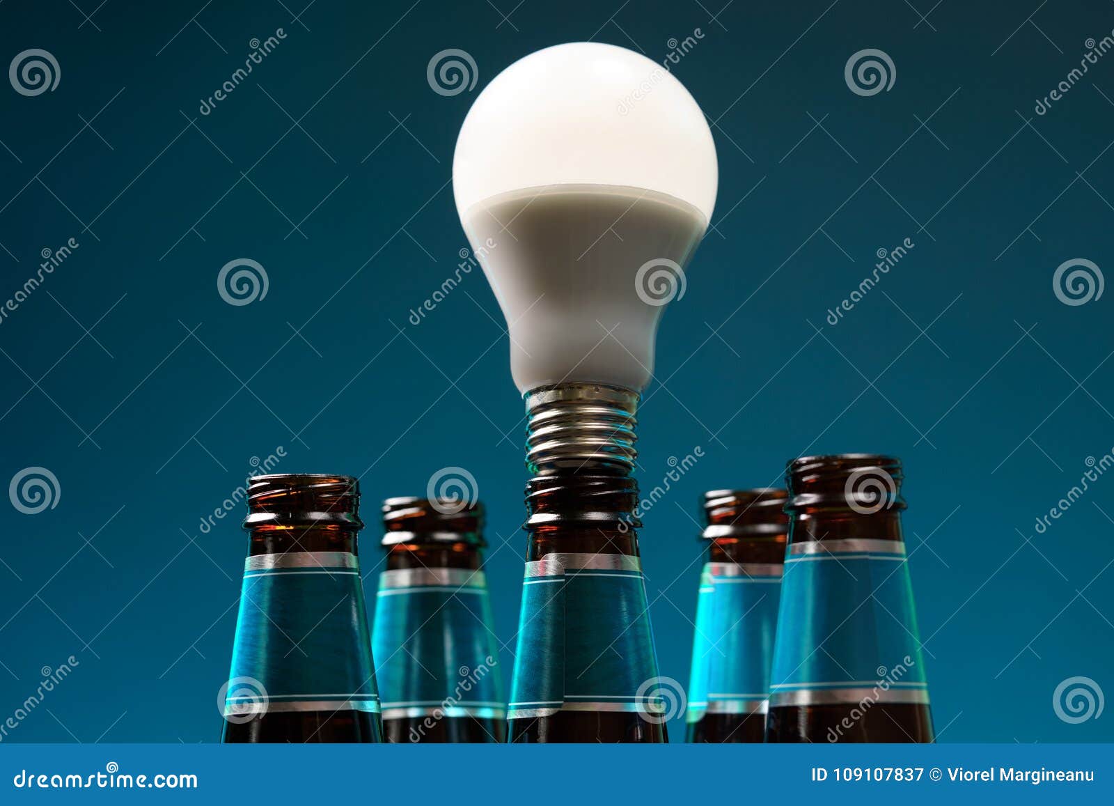 Light Bulb Inserted into an Empty Bottle. Stock Image - Image of ...