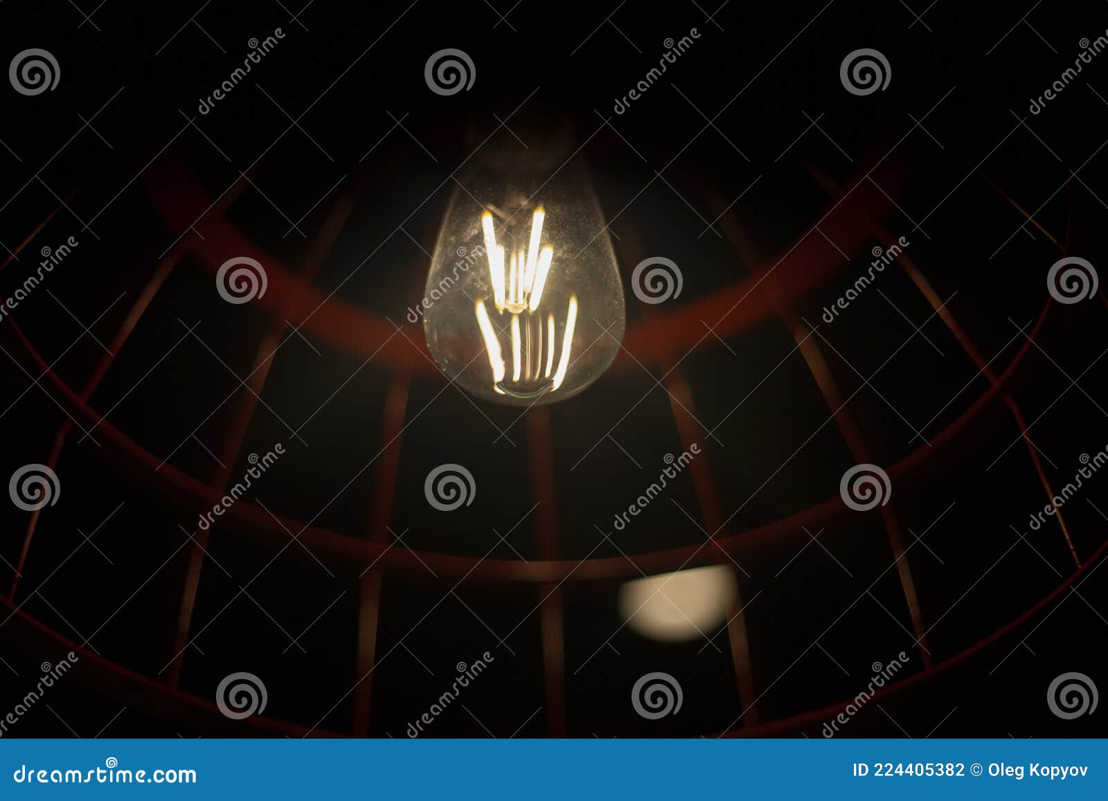 Light Bulb in the Interior. Light Bulb in a Dark Room Stock Photo ...