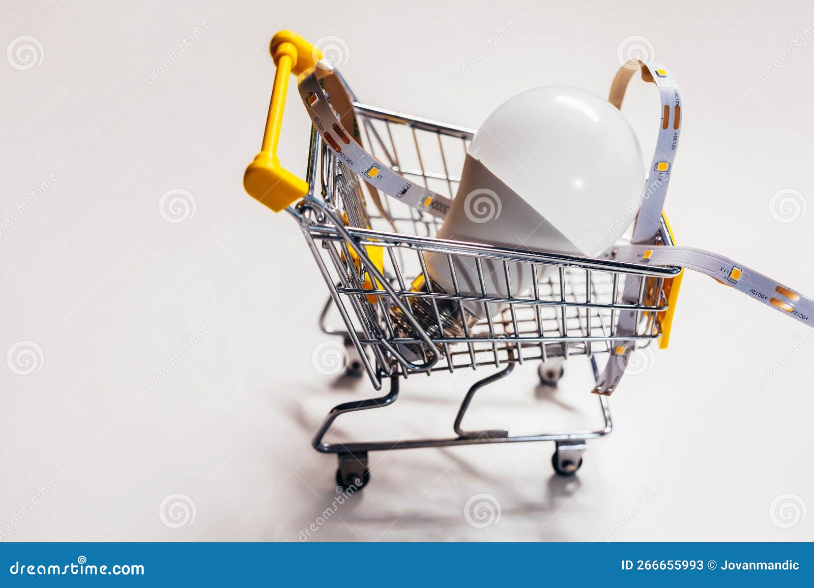 Light Bulb and Led Light Strip in Shopping Trolley. Saving Energy Stock ...