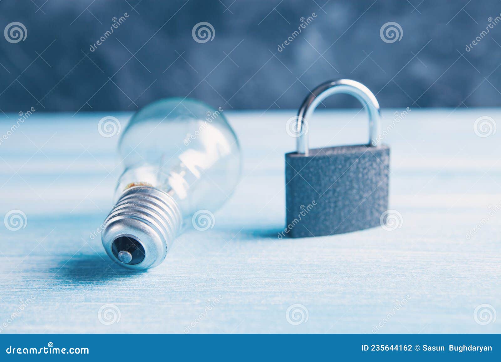 Light Bulb and Lock on the Table Stock Photo - Image of lock ...