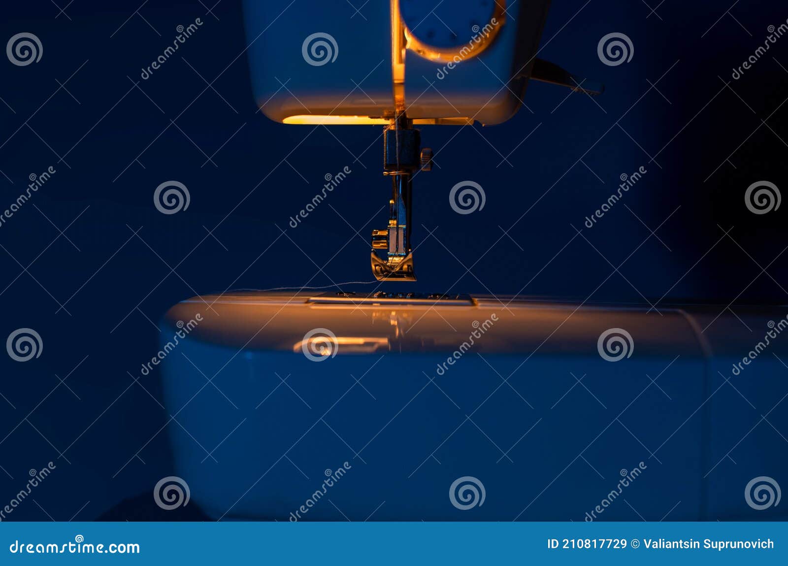 Light from Bulb of Modern Sewing Machine in Darkness Stock Image ...