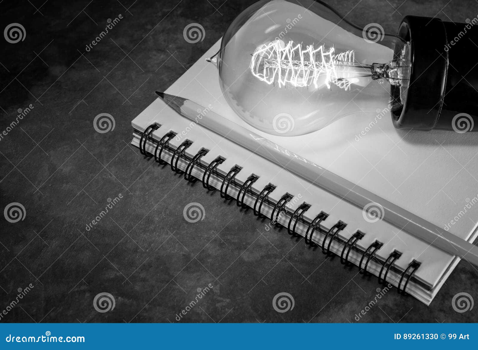 Light Bulb on a Notebook with Pencil, Inspiration and Education Stock ...