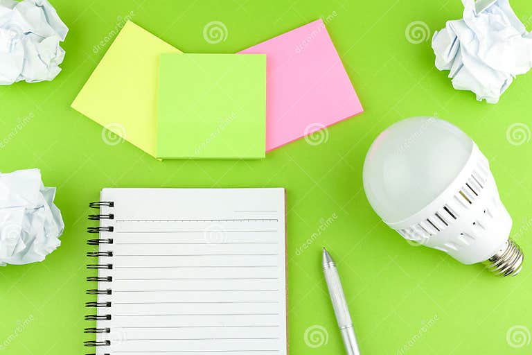 Light Bulb and Notes on a Green Background Stock Image - Image of ...