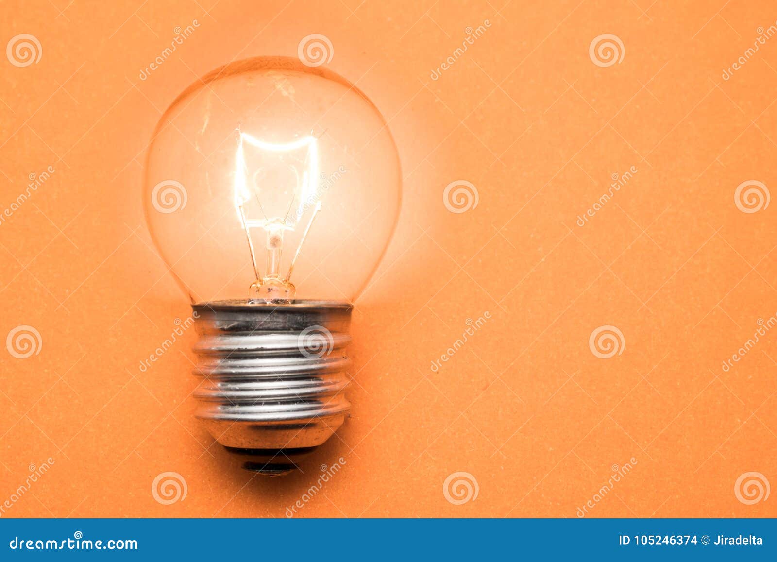 Light Bulb with Orange Background Stock Photo - Image of orange, shot ...