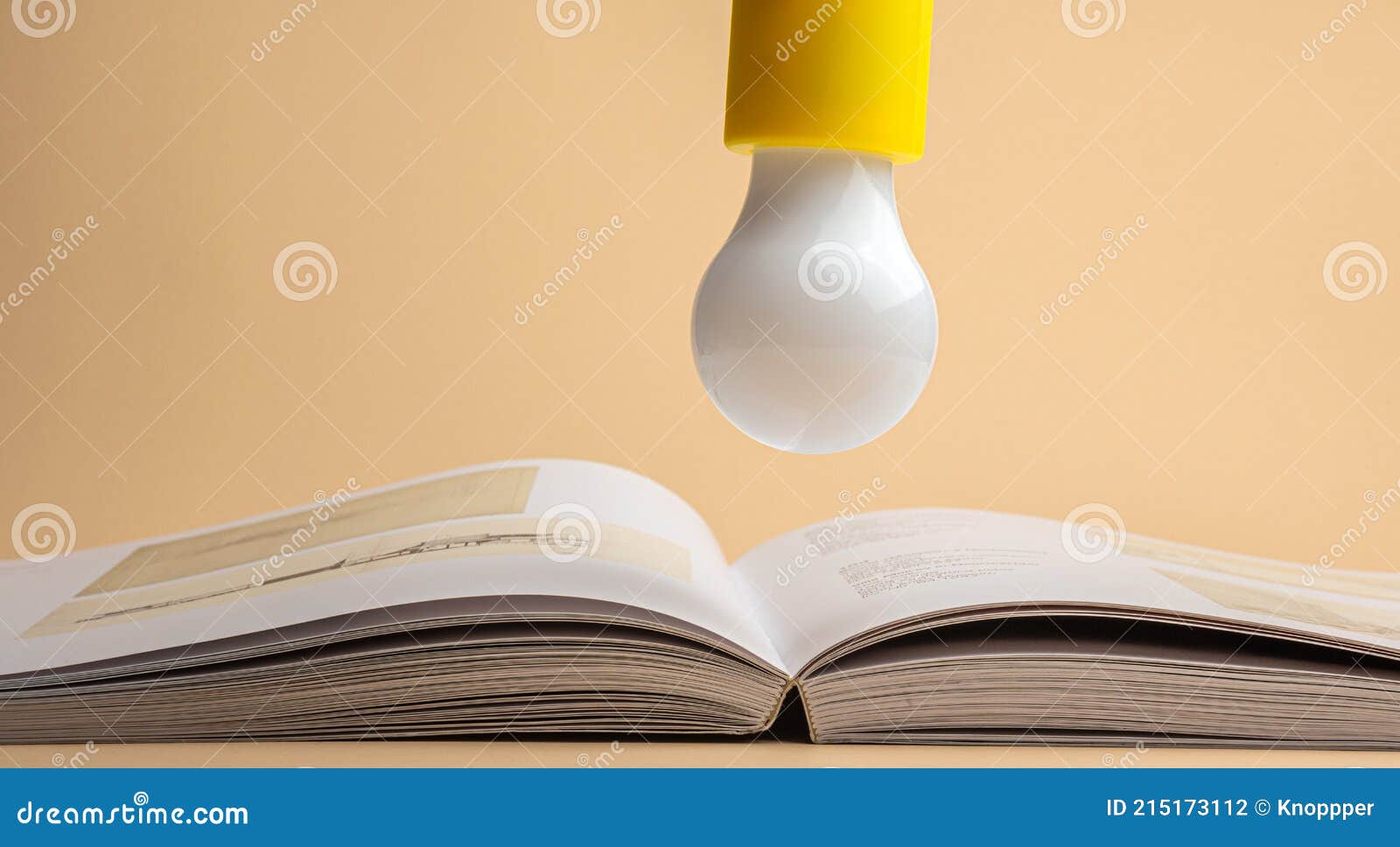 A Light Bulb Over an Open Book Stock Photo - Image of read, open: 215173112