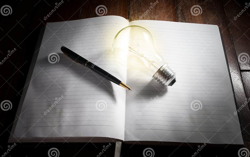 Light Bulb with Pen on Book. Stock Image - Image of glowing, education ...