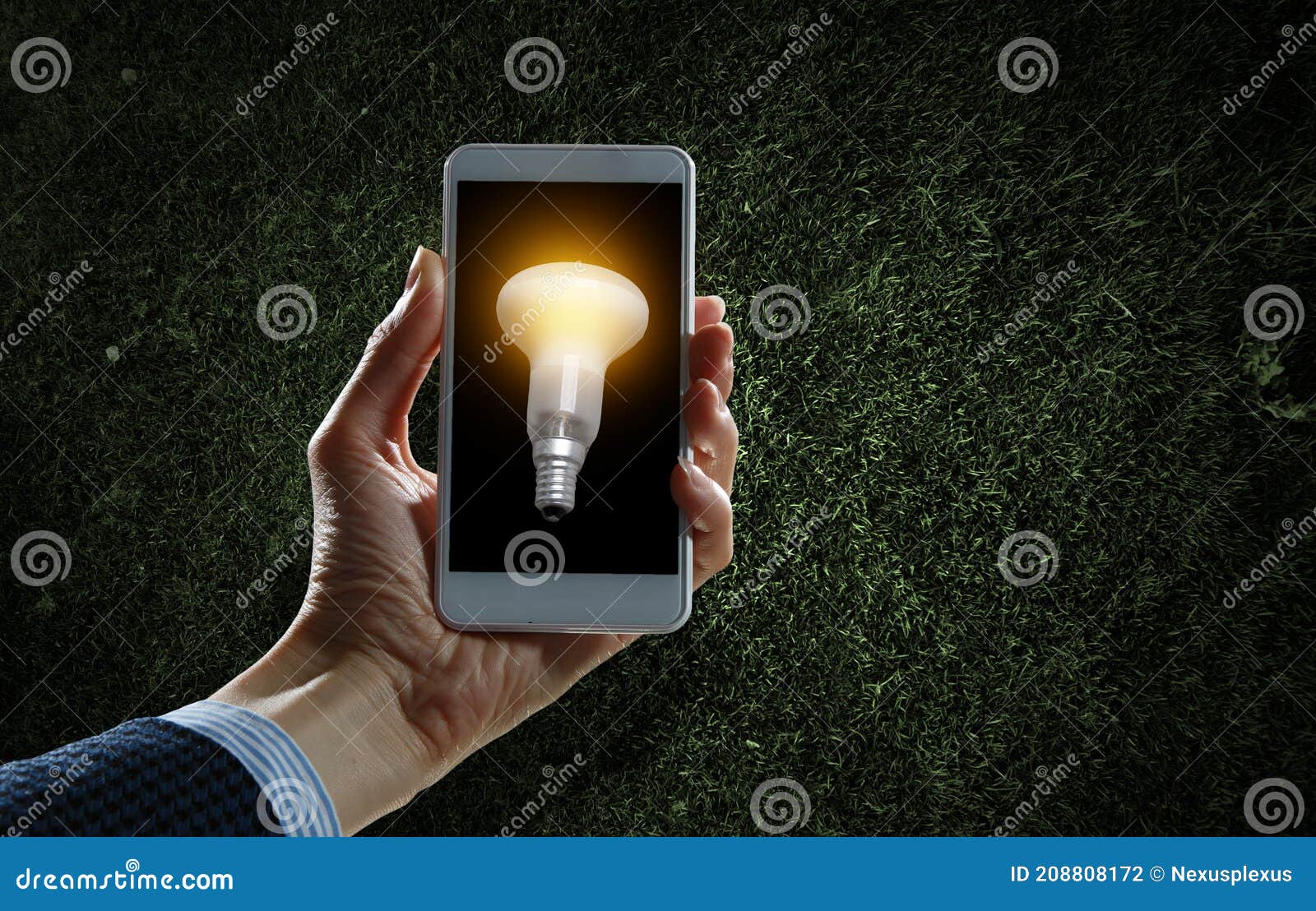 Light bulb on phone screen stock photo. Image of illumination - 208808172